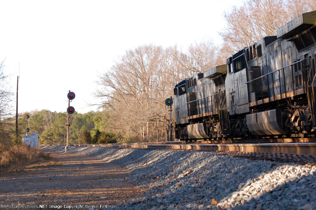 CSX AC44CW's 57 & 222 lead hopper train T108-12 past a clear signal at the north end